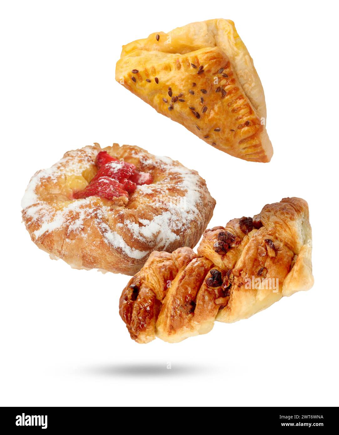 Different tasty puff pastries falling on white background Stock Photo ...
