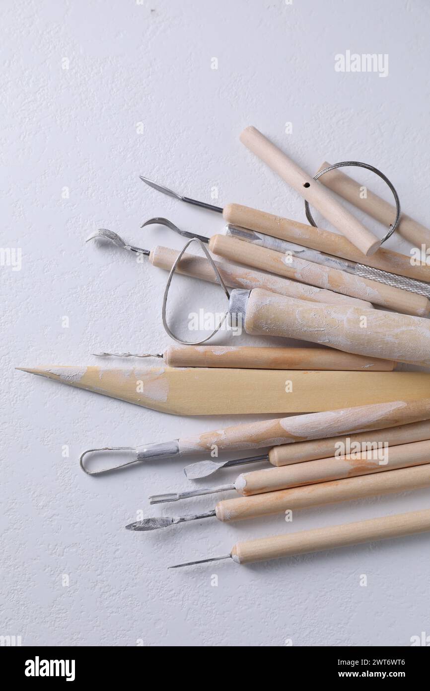 Set of different clay crafting tools on white table, top view Stock ...
