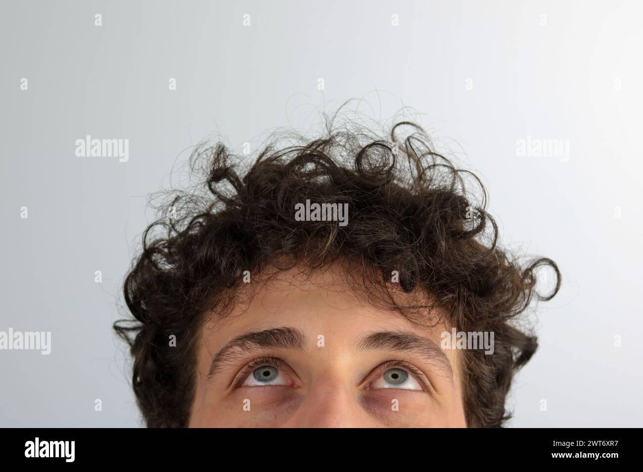 half face of teenager looking up thinking, white background Stock Photo ...