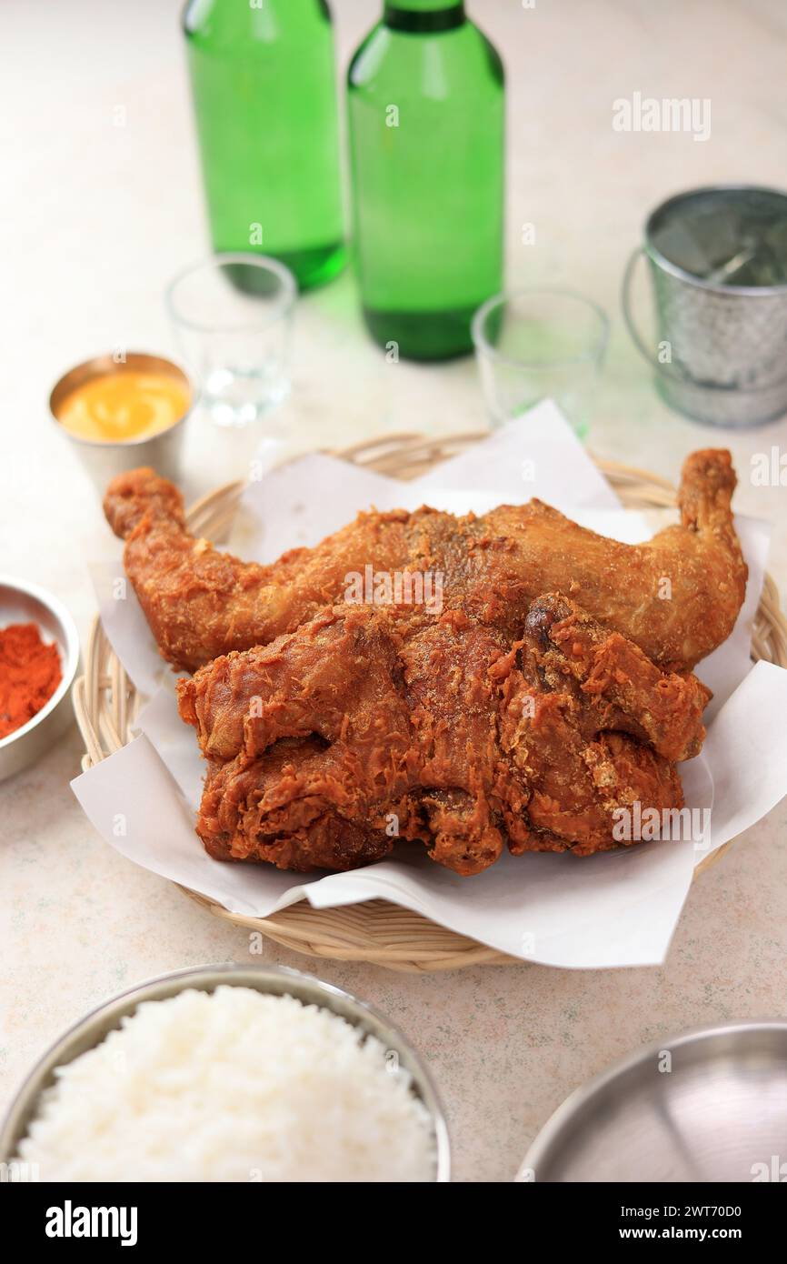 Eat Whole Deep Fried Chicken with Drinking Soju, Korean Lifestyle Stock ...
