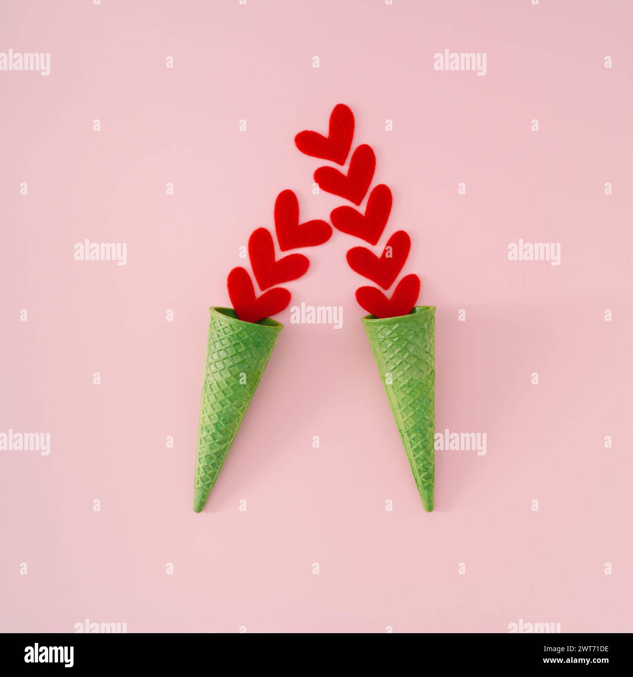 Summer love cream. Creative layout made with red hearts and green ...