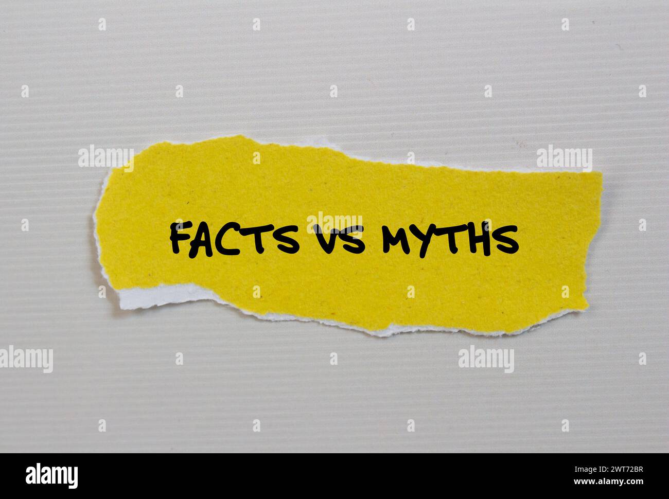 Facts vs myths words written on yellow torn paper piece with white ...