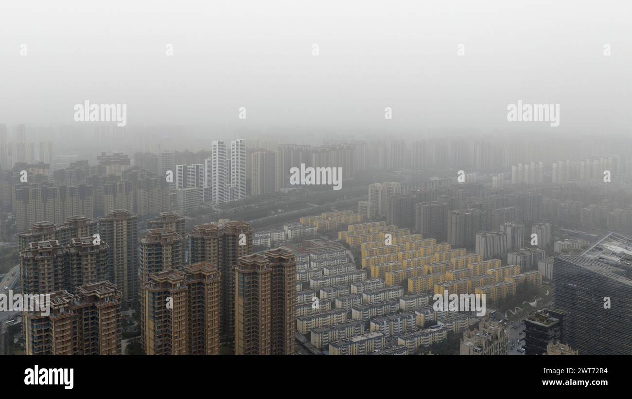 XI'AN, CHINA - MARCH 16, 2024 - City buildings loom under smog in Xi ...