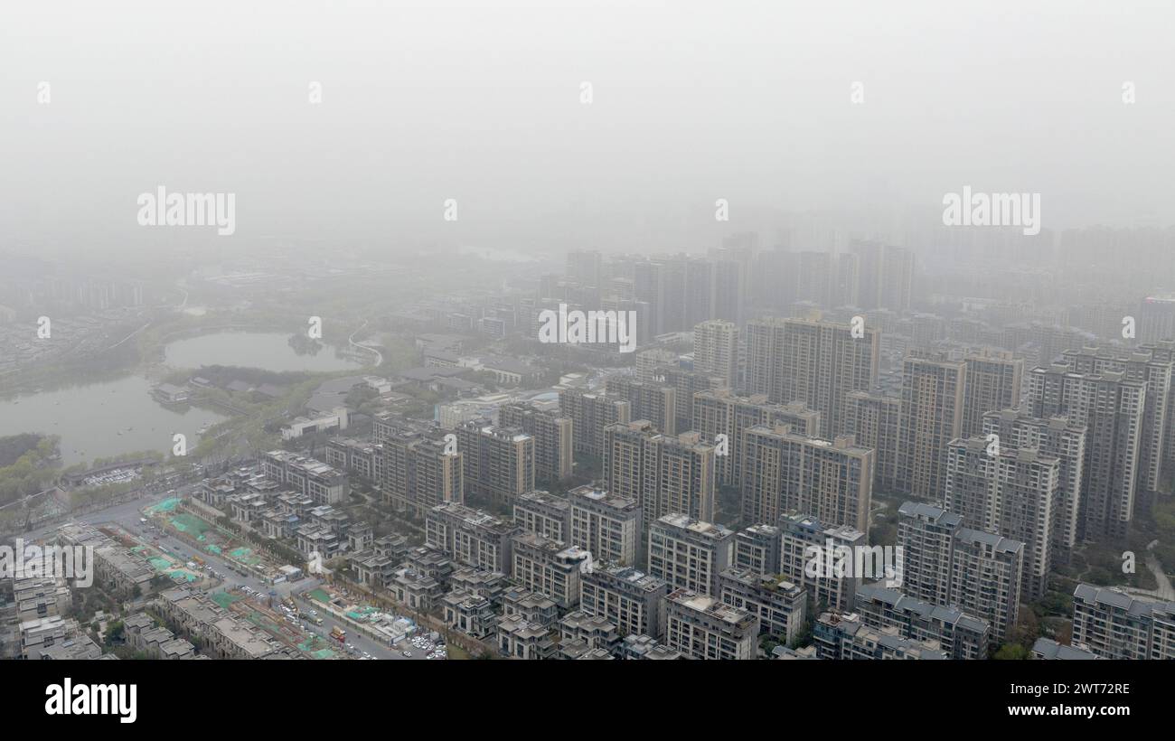 XI'AN, CHINA - MARCH 16, 2024 - City buildings loom under smog in Xi ...