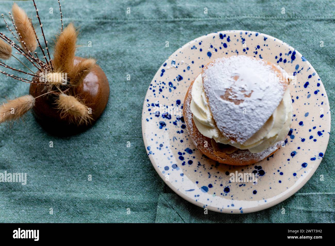 Typical Swedish semla with sweet cream on te blue textile Stock Photo ...