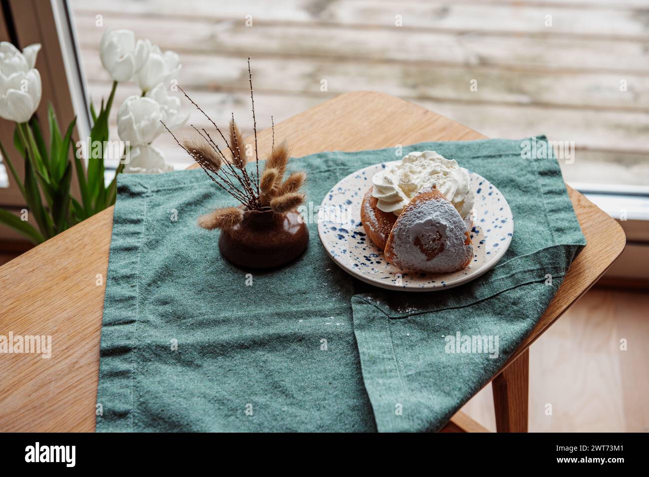 Typical Swedish semla with sweet cream on te blue textile Stock Photo ...