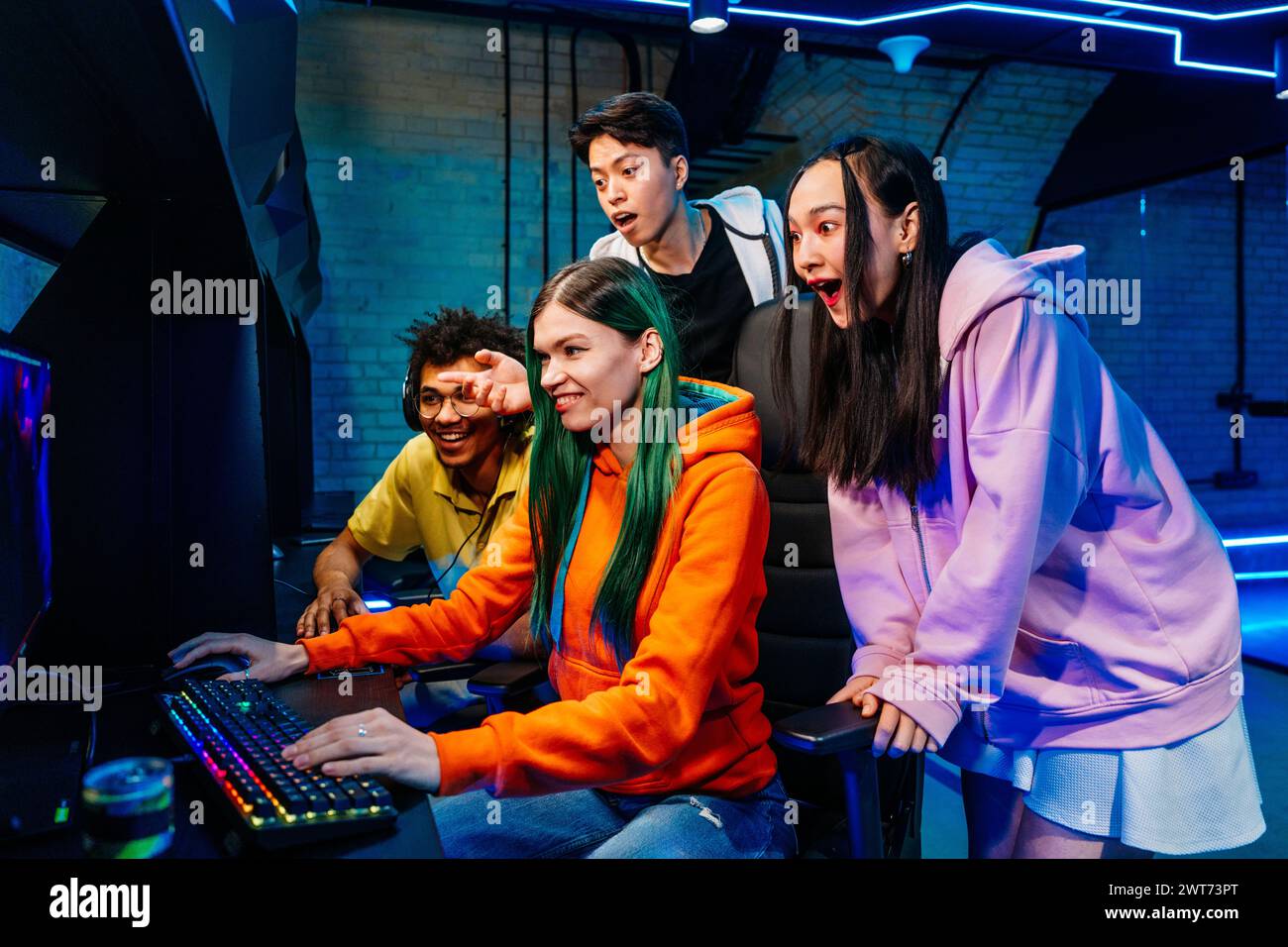 Multiethnic group of young friends playing videogames - Team of ...