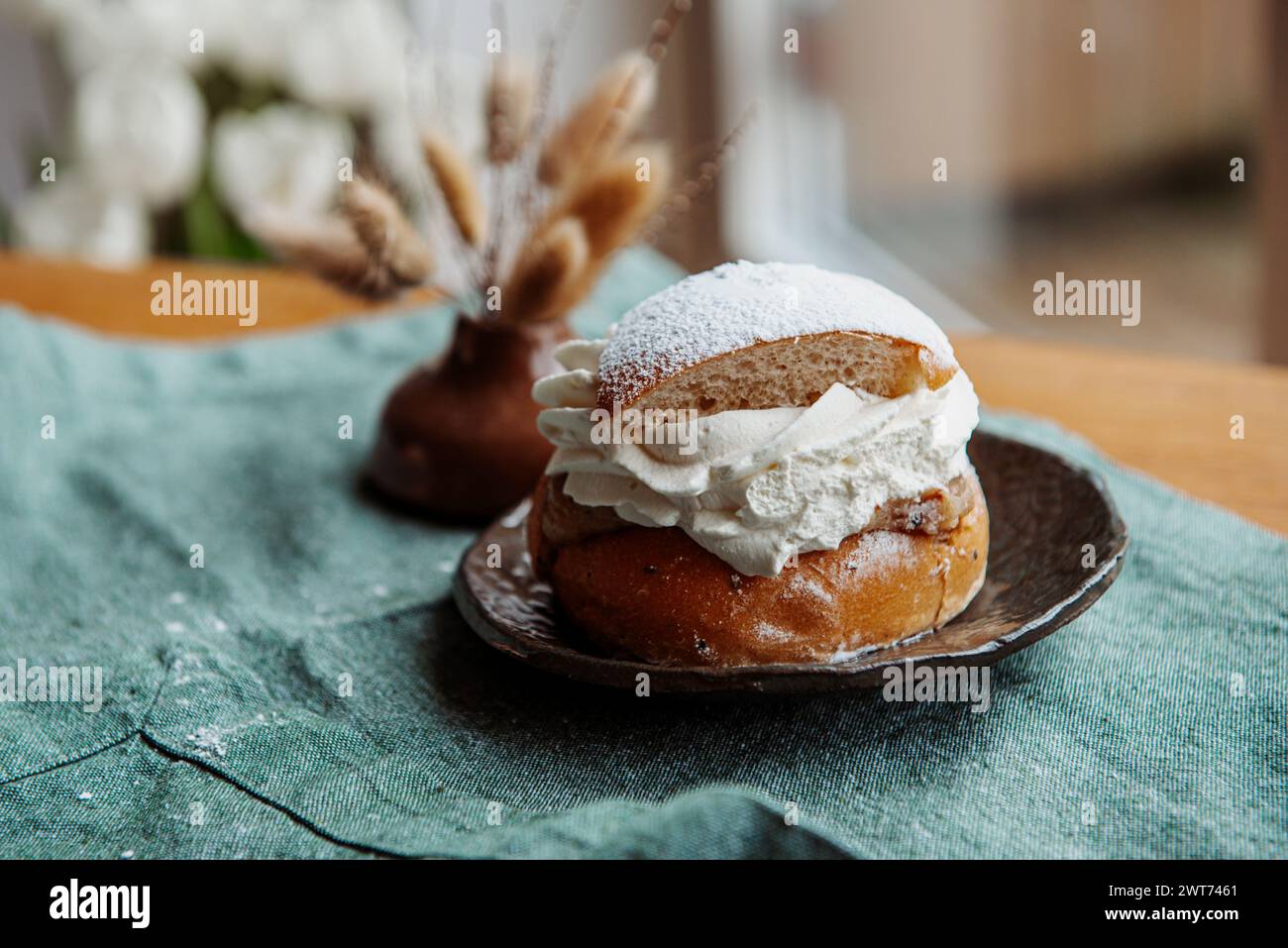 Typical Swedish semla with sweet cream on te blue textile Stock Photo ...