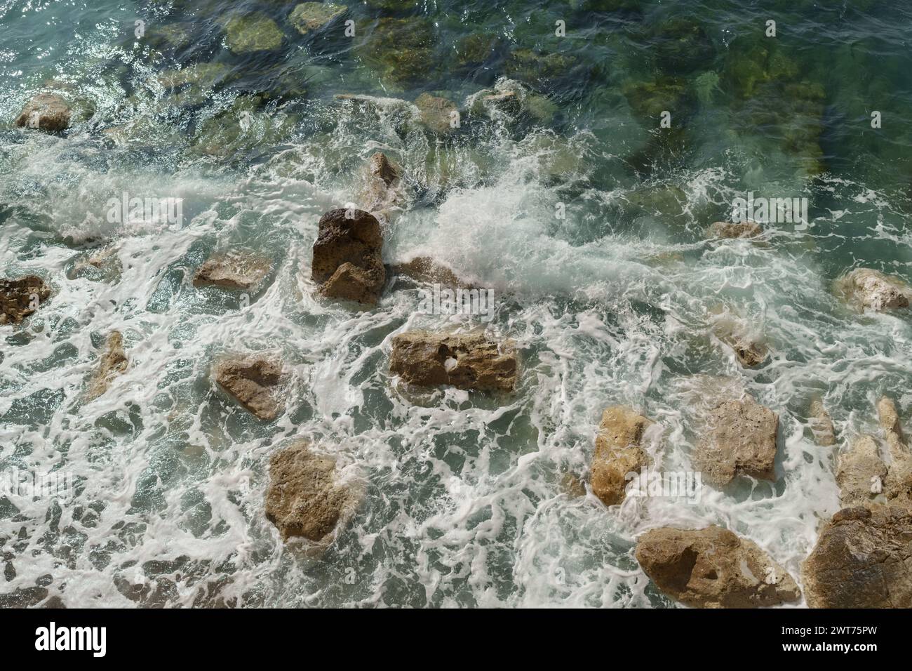 Top down view of sea waves crushing onto rocks, nature photo Stock ...