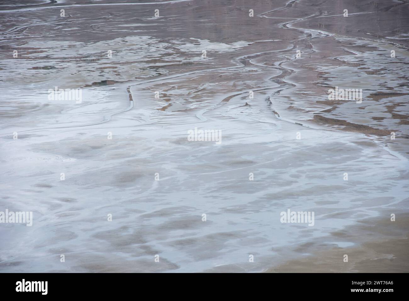 Muddy waters in a decantation pond. Toxic residuals from a copper mine ...