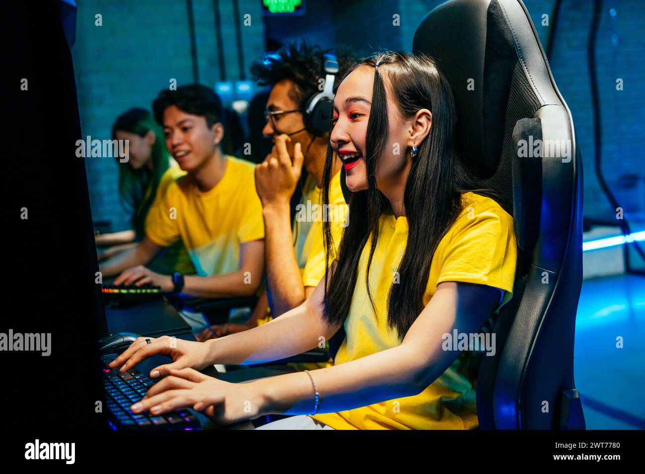 Multiethnic group of young friends playing videogames - Team of ...