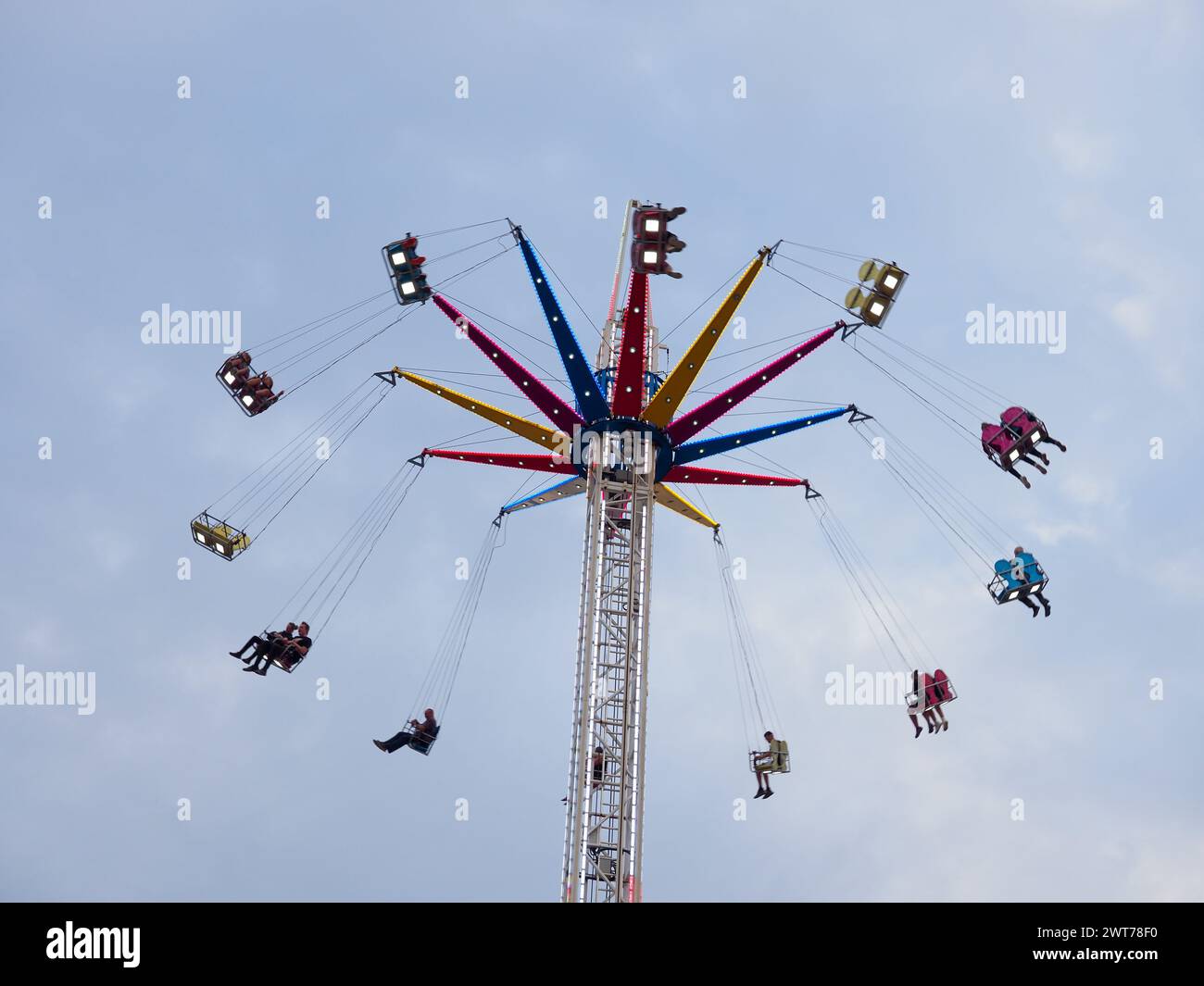 People on a fairground ride Stock Photo - Alamy