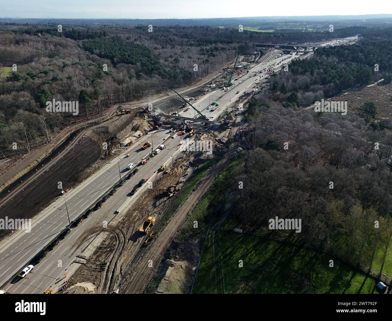 Workman on the section of the M25 between Junctions 10 and 11, in ...