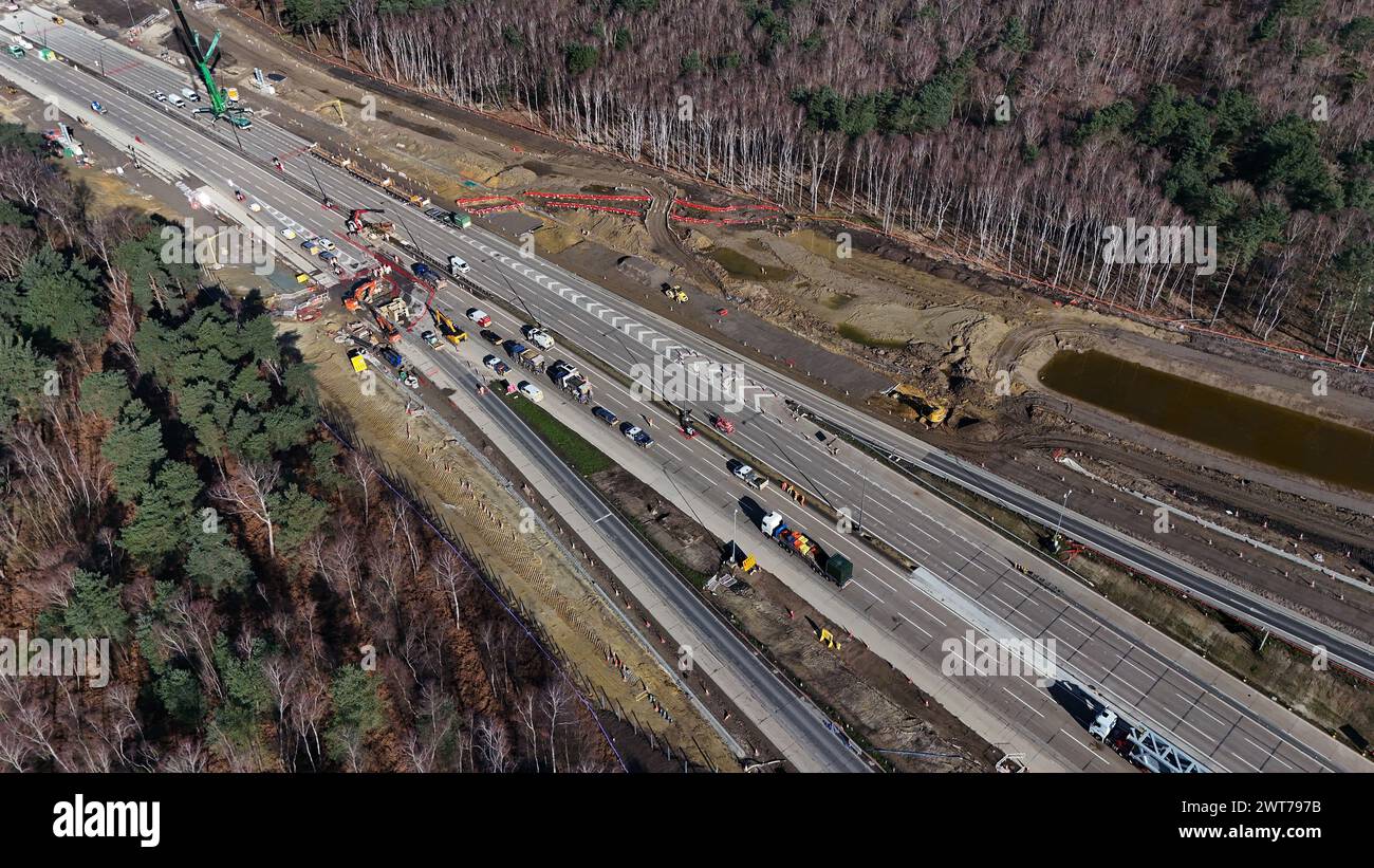 Workman on the section of the M25 between Junctions 10 and 11, in ...