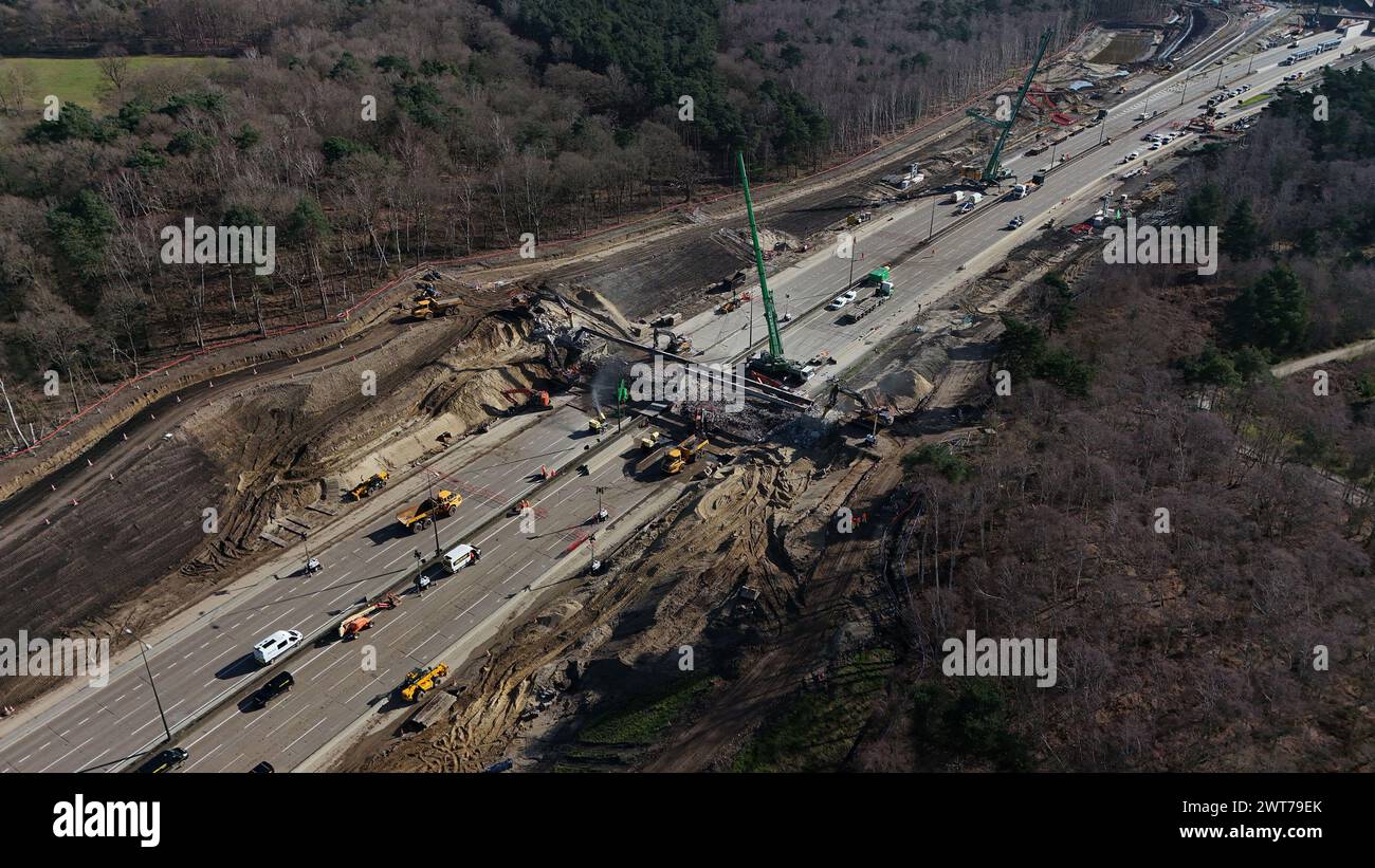 Workman on the section of the M25 between Junctions 10 and 11, in ...