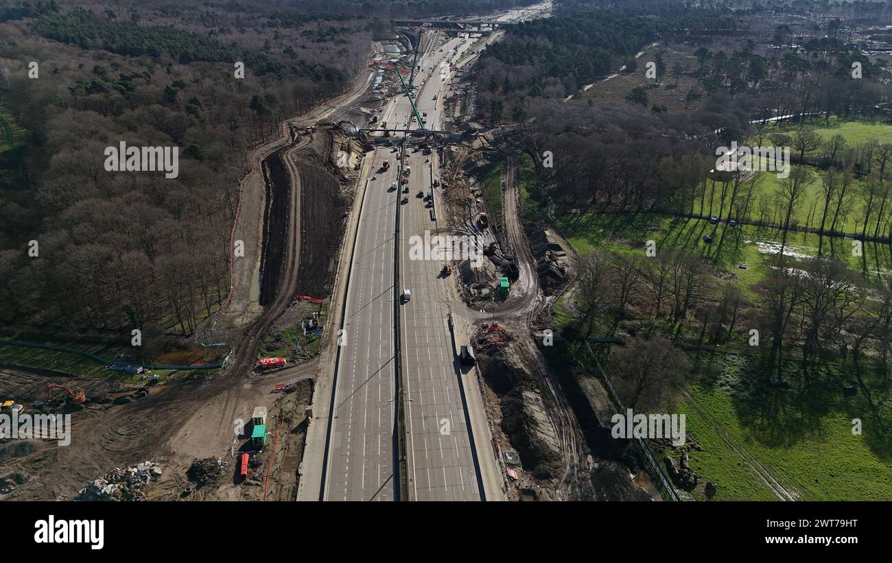 Workman on the section of the M25 between Junctions 10 and 11, in ...