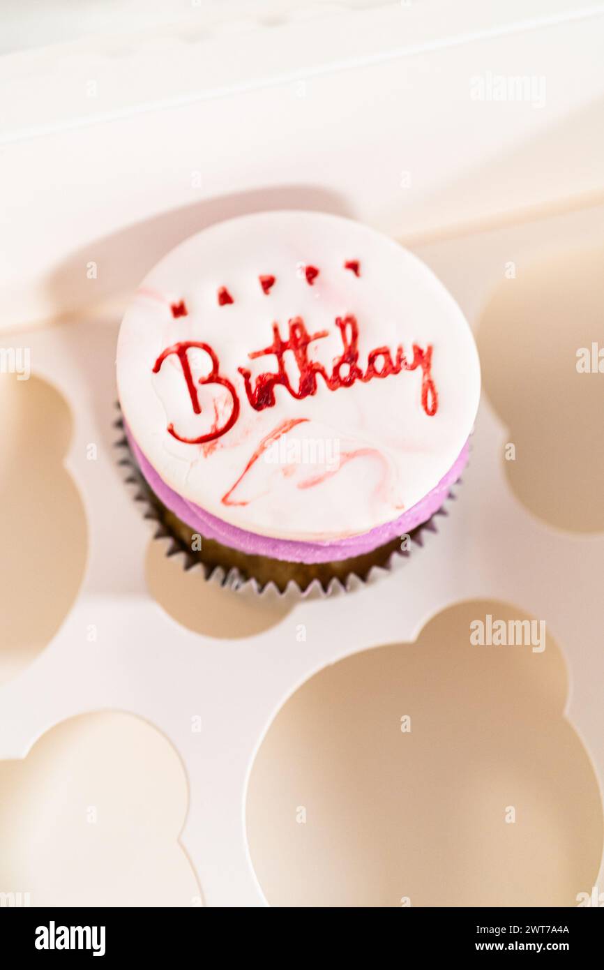 Creating Extravagant Cupcakes for Birthday Celebration Stock Photo - Alamy