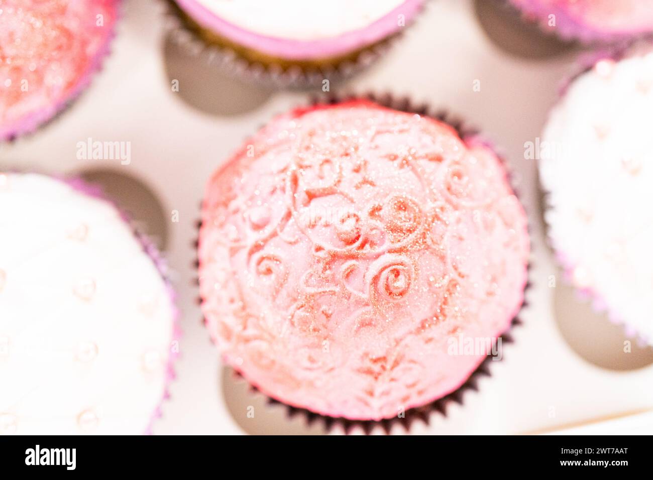 Creating Extravagant Cupcakes for Birthday Celebration Stock Photo - Alamy