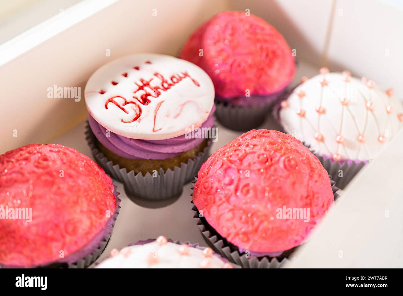 Creating Extravagant Cupcakes for Birthday Celebration Stock Photo - Alamy