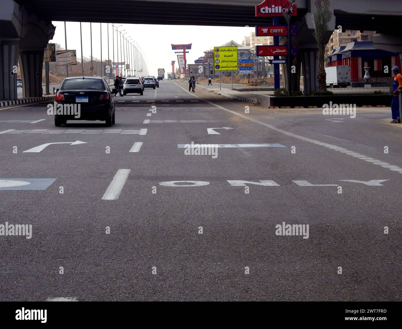 Cairo, Egypt, November 23 2022: A road sign on the asphalt indication a ...