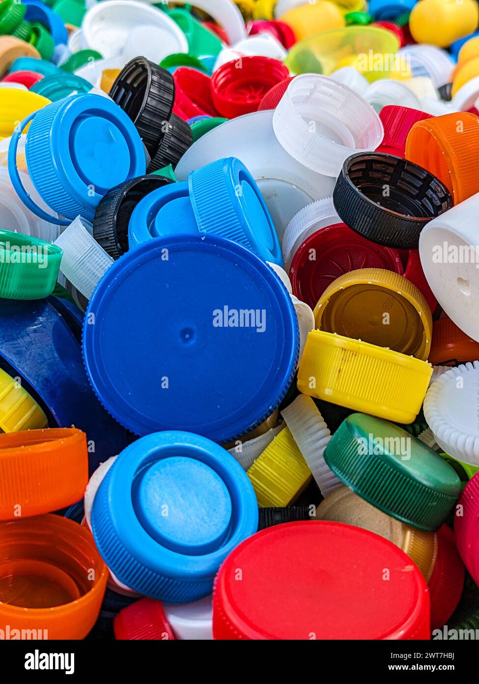 Lots of different plastic bottle caps. Garbage sorting Stock Photo - Alamy