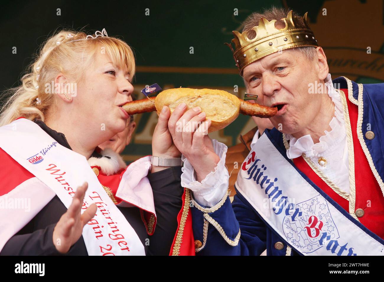 Sausage Queen Silvia, left, and Bratwurst King Norbert bite into a ...