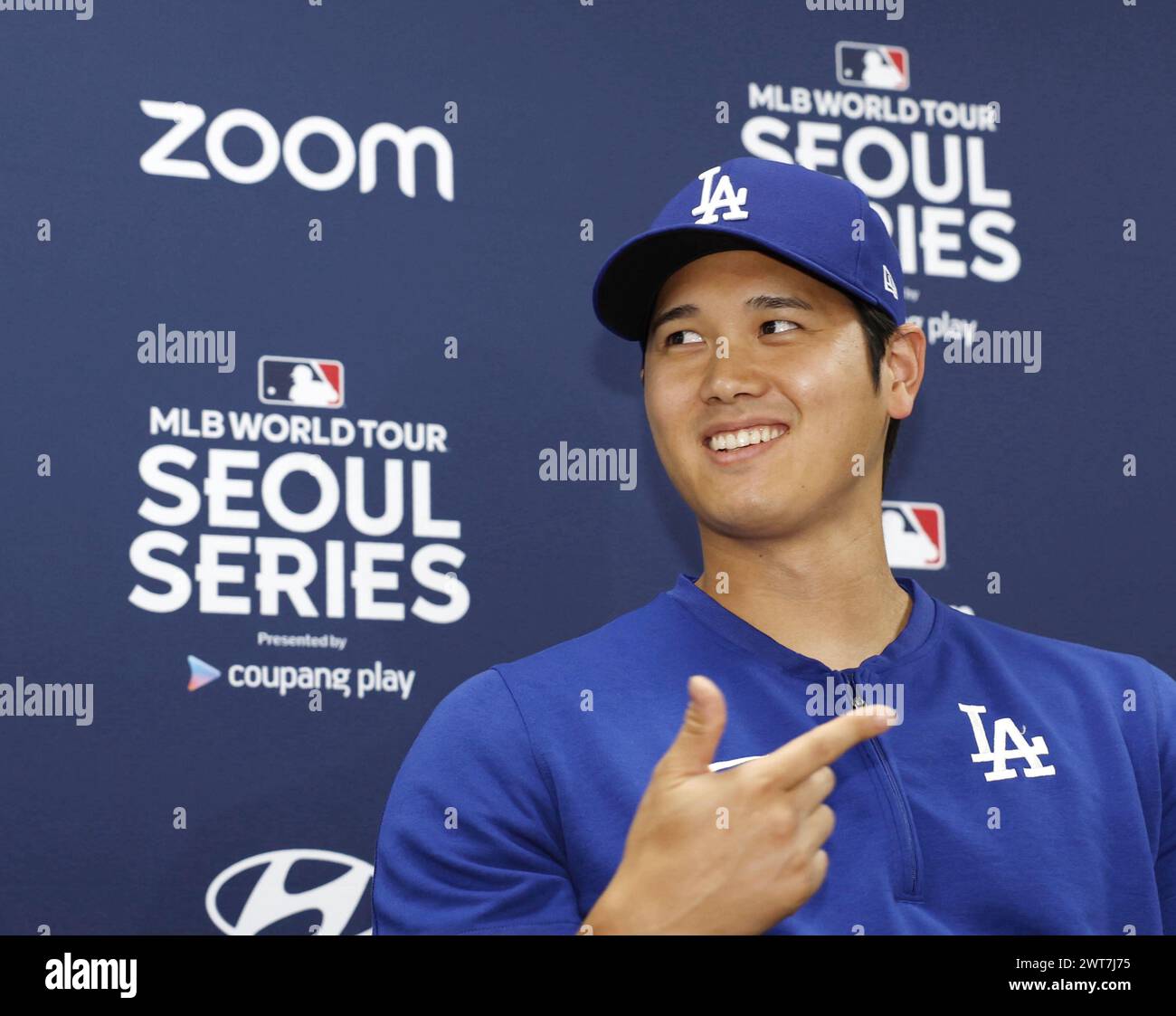 Los Angeles Dodgers star Shohei Ohtani smiles during a press conference ...