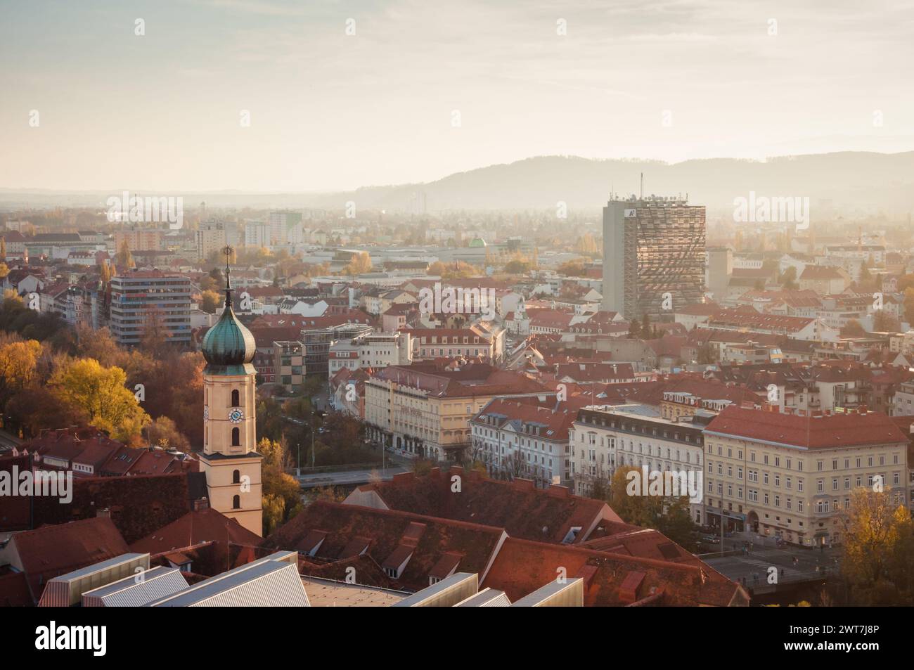 Aerial view of Graz cityscape at sunset. City overview from Schlossberg ...