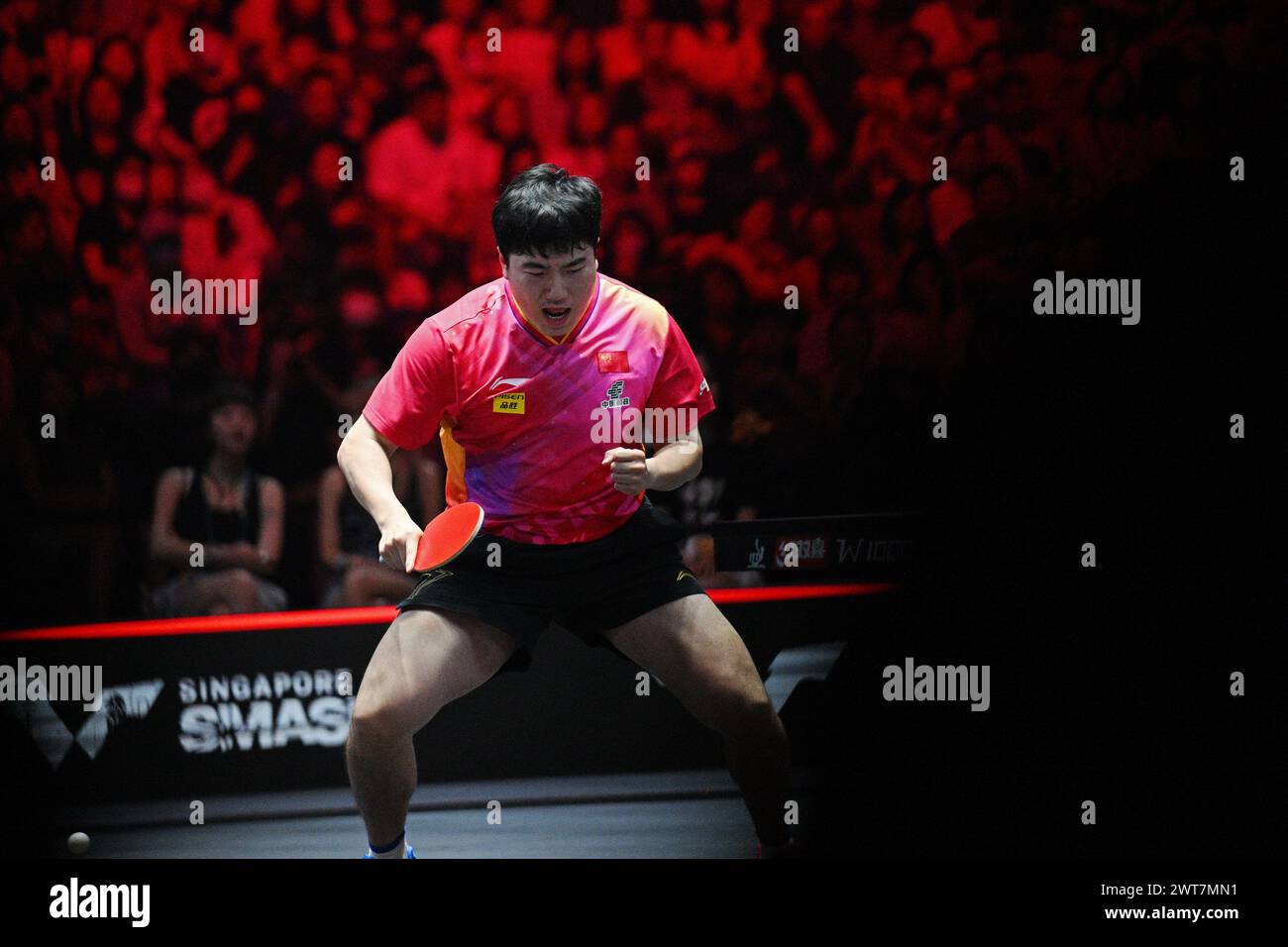 Singapore. 16th Mar, 2024. Liang Jingkun of China celebrates scoring ...