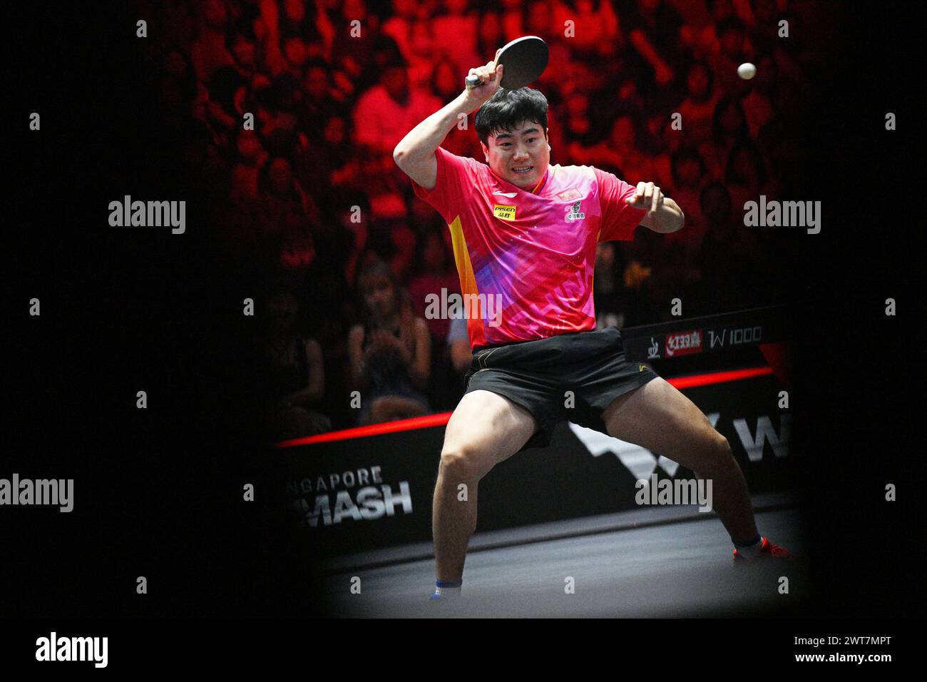 Singapore. 16th Mar, 2024. Liang Jingkun of China hits a return during ...