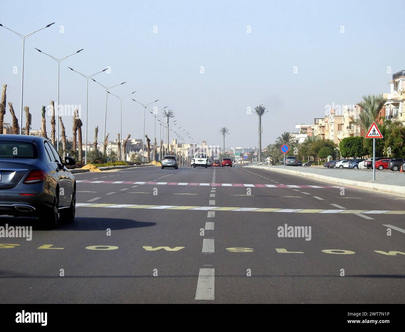 Cairo, Egypt, December 14 2022: A road sign on the asphalt instructing ...