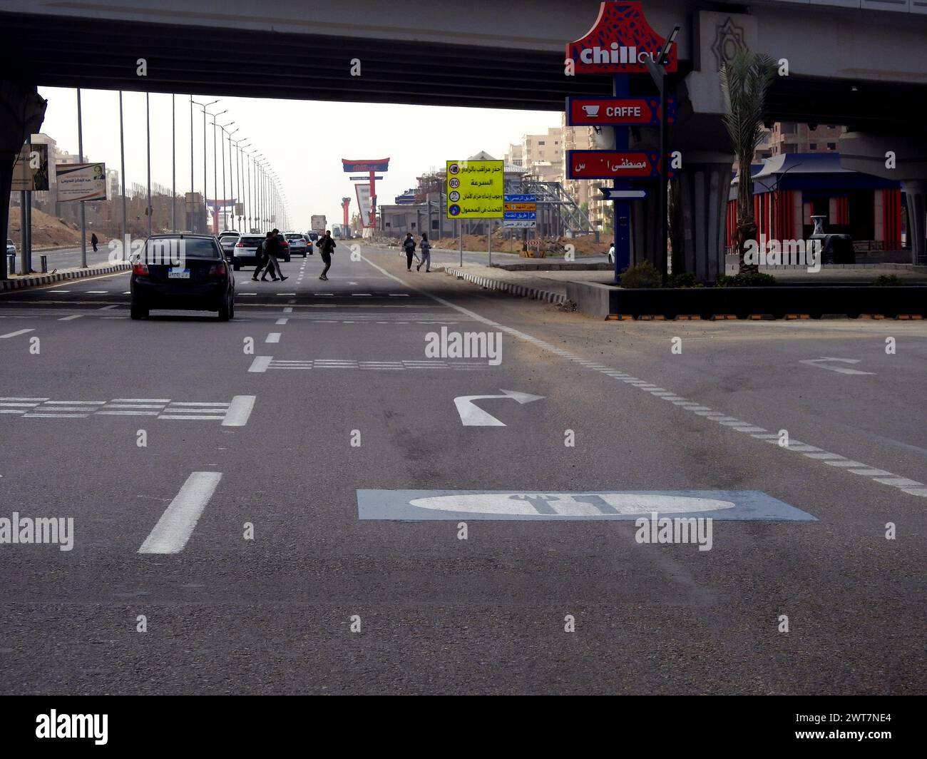 Cairo, Egypt, November 23 2022: A road sign on the asphalt indication a ...
