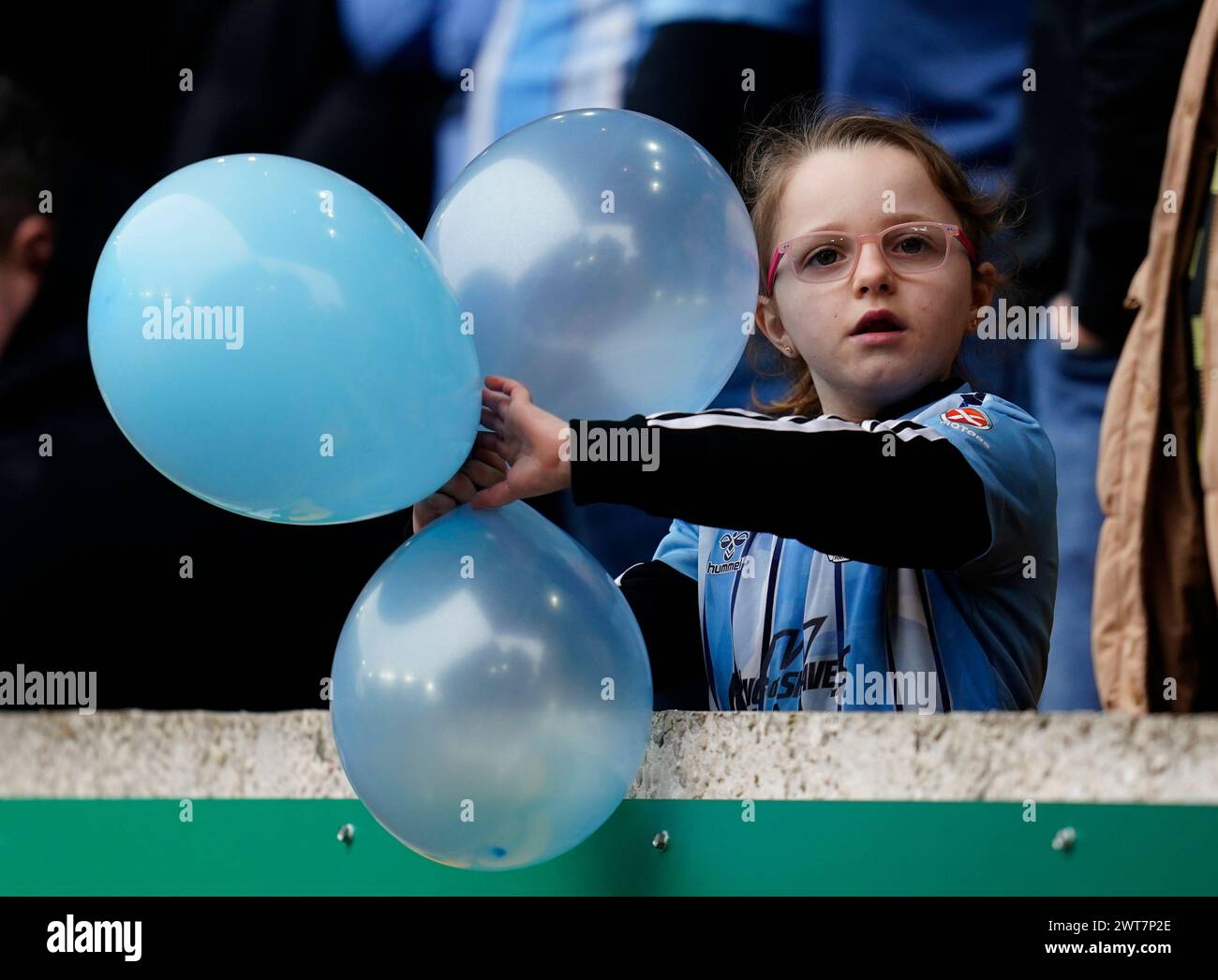 A young Coventry City fan with balloons in the stands during the ...