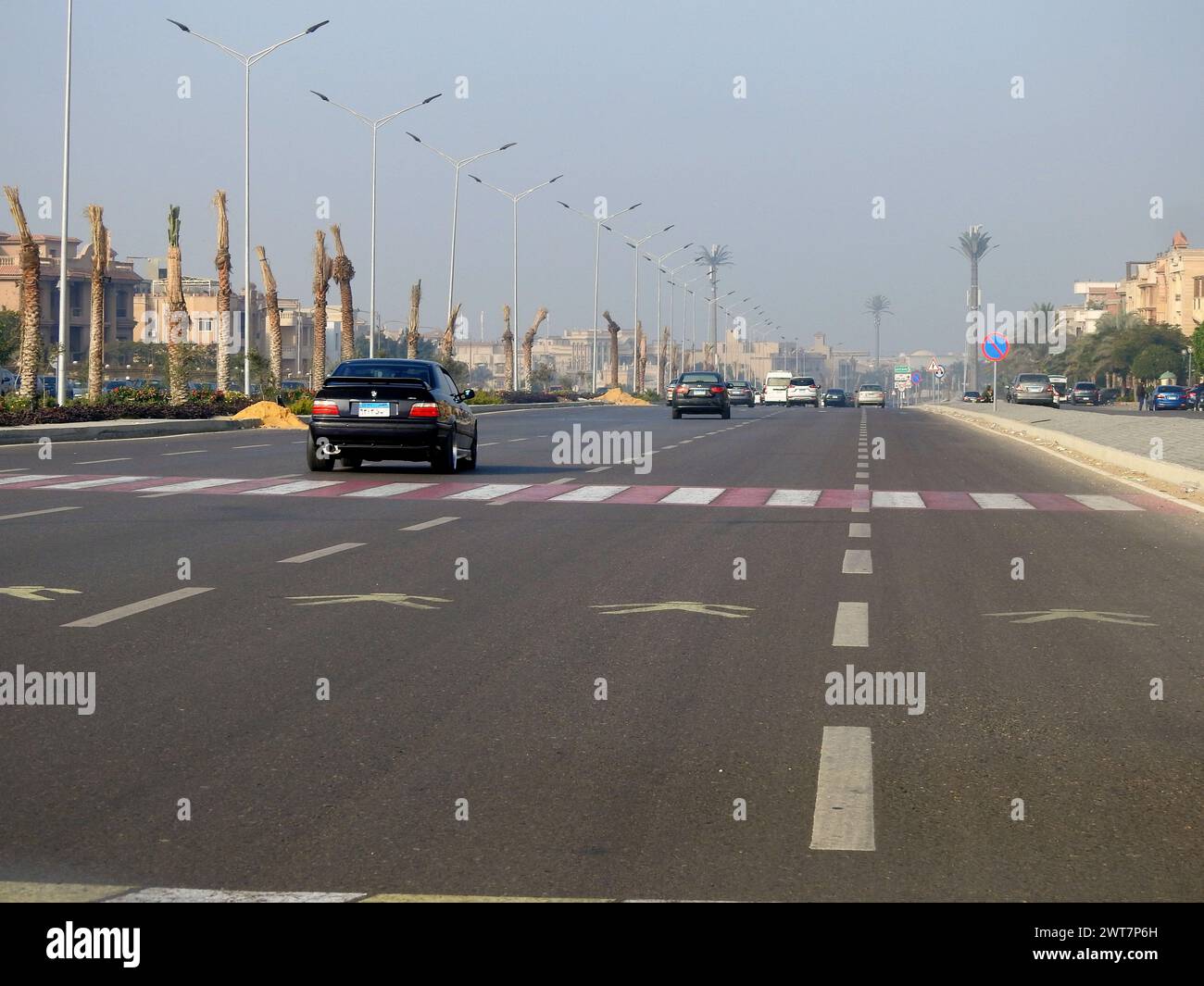 Cairo, Egypt, December 13 2022: A road sign on the asphalt instructing ...
