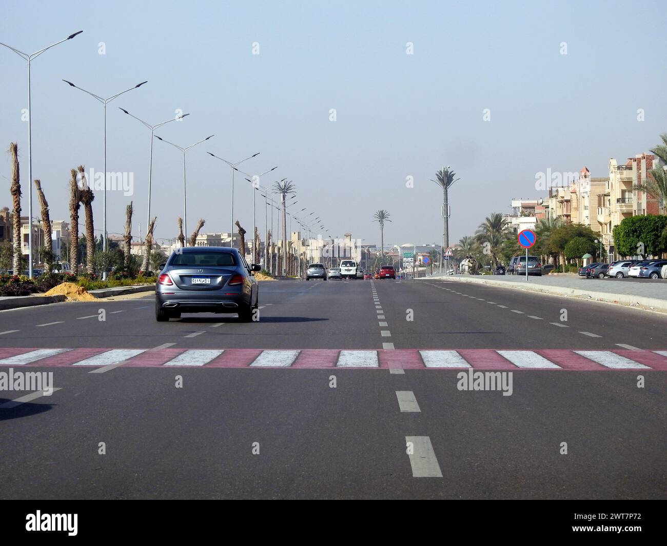 Cairo, Egypt, December 14 2022: A road sign on the asphalt instructing ...