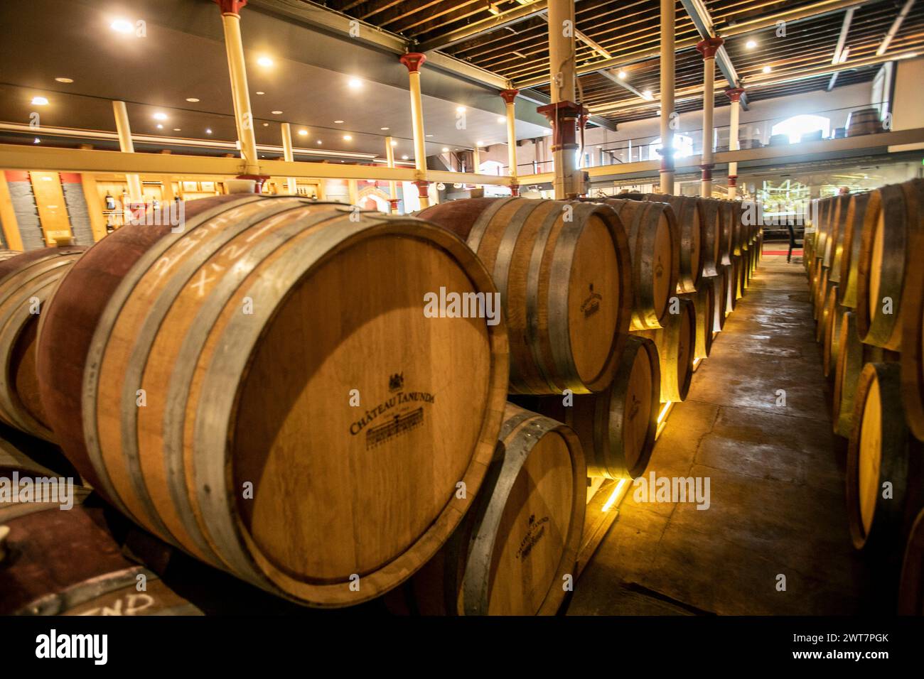 Wooden barrels full of wine in the cellar door at Chateau Tanunda ...