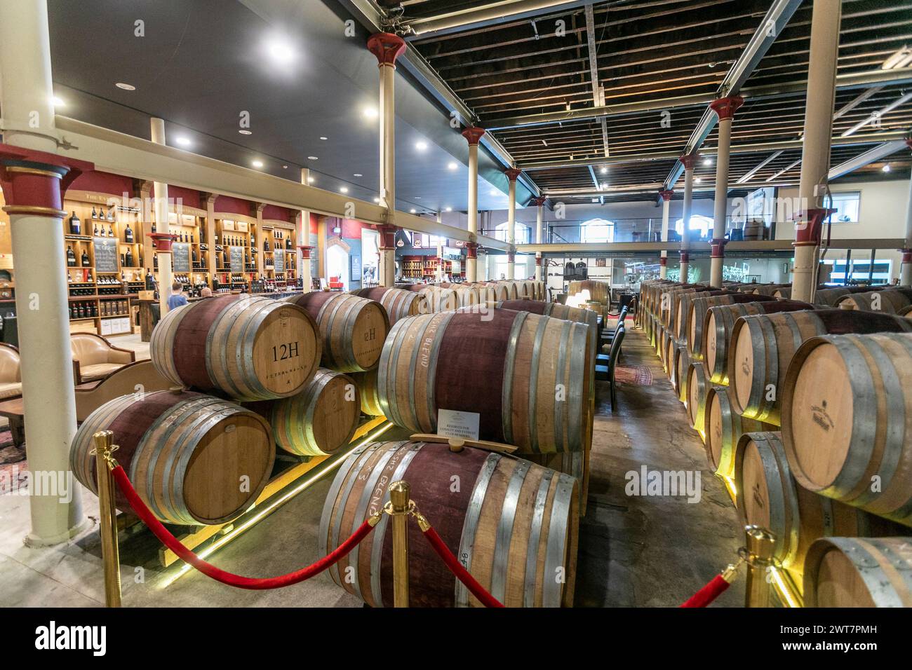 Wooden barrels full of wine in the cellar door at Chateau Tanunda ...