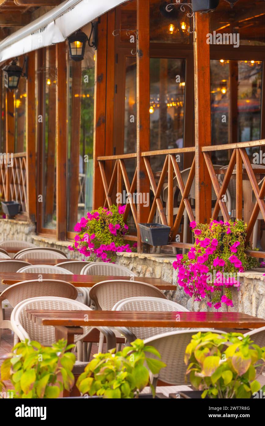Ohrid, North Macedonia, Flowers decorated summer restaurant terrace ...