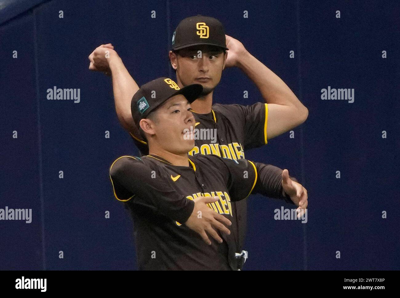 San Diego Padres pitcher Yu Darvish, top, and Yuki Matsui stretch ...