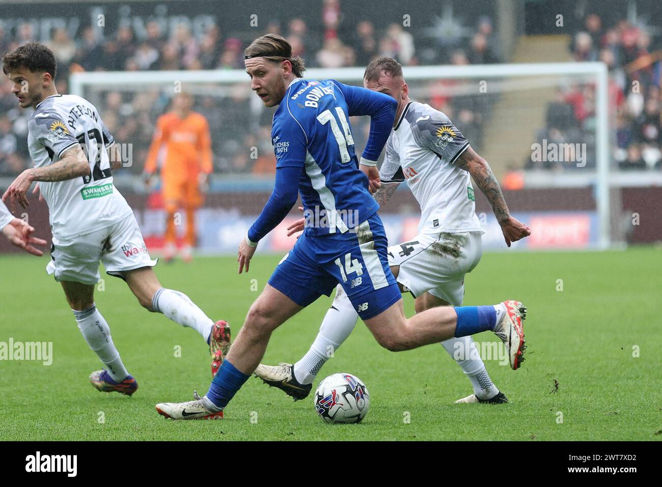 Cardiff City's Josh Bowler (centre) and Swansea City's Jay Fulton ...