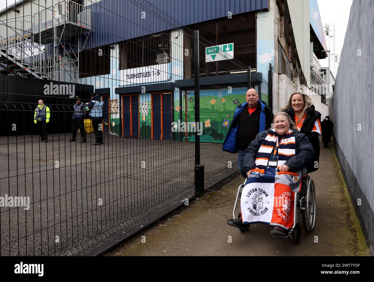 Luton Town fans arrive at the ground ahead of the Premier League match ...