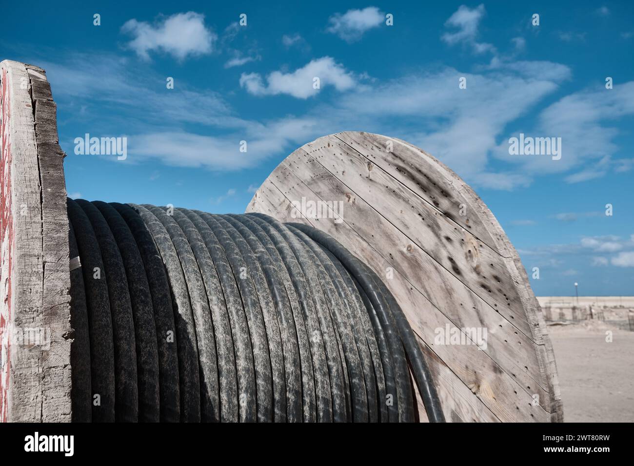 Wooden bobbin with electrical cable Stock Photo - Alamy