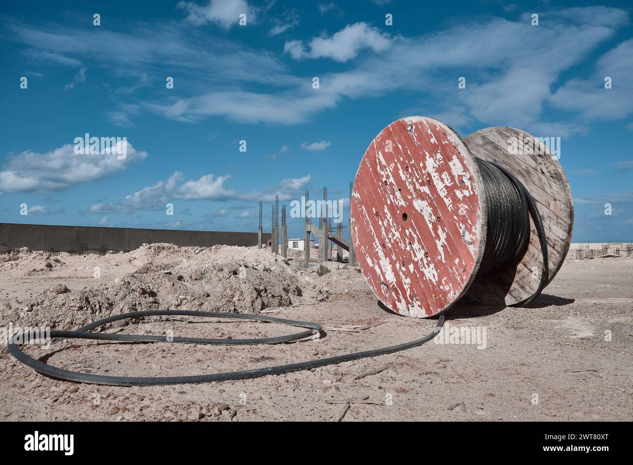 Cable on a reel at construction site Stock Photo - Alamy
