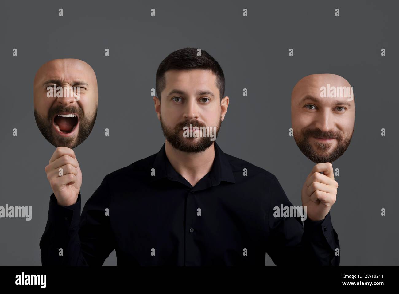 Man holding masks with his face showing different emotions on grey ...