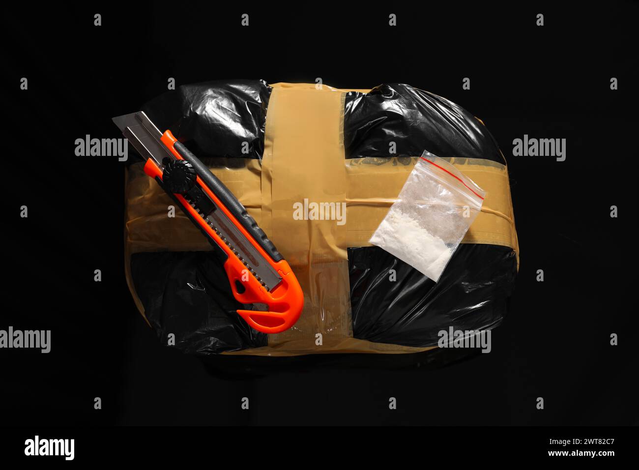 Smuggling, drug trafficking. Packages with narcotics and utility knife ...