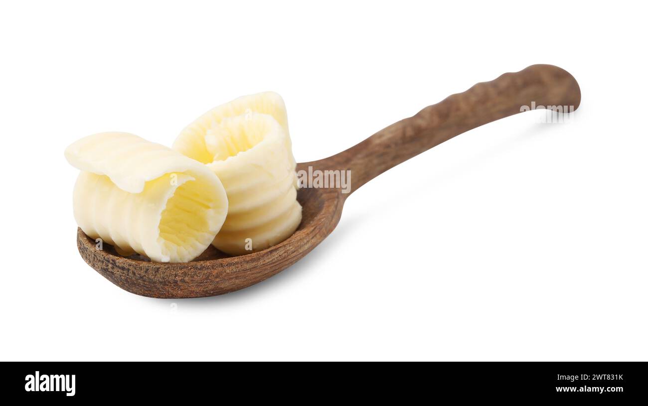 Tasty butter curls in spoon isolated on white Stock Photo - Alamy