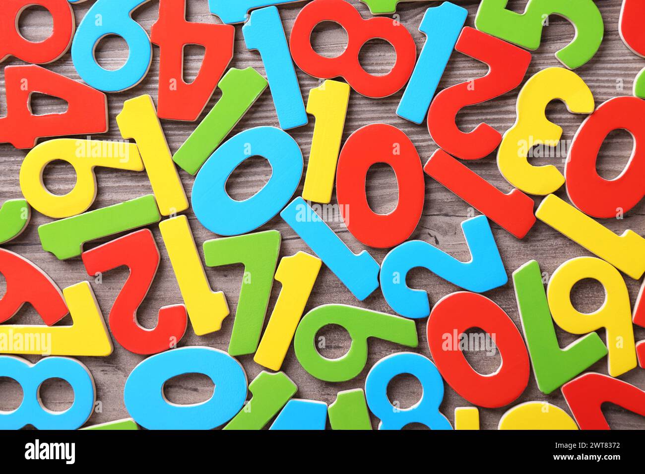 Colorful numbers on wooden school desk, top view Stock Photo - Alamy