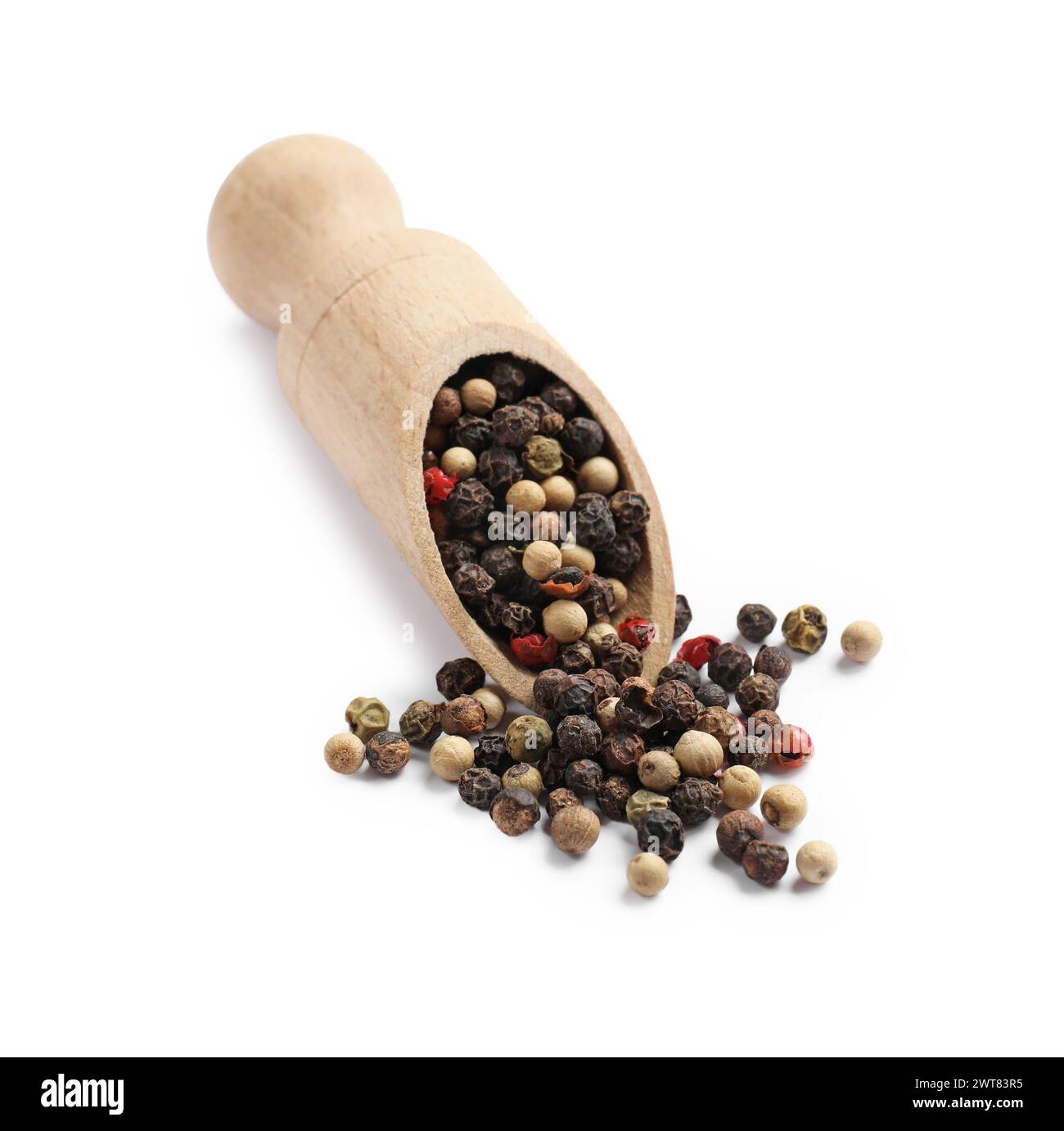 Aromatic spices. Different peppers and wooden scoop isolated on white ...