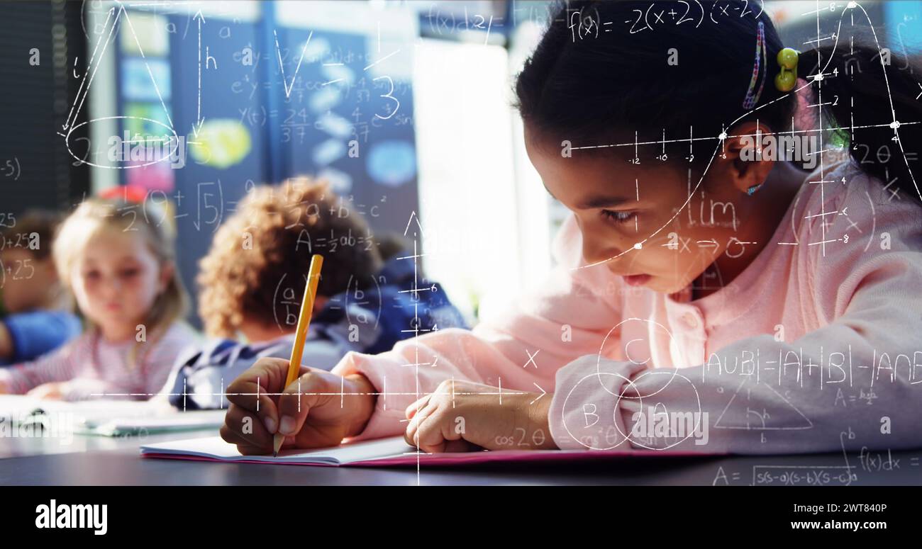Image of math formulas over focused biracial girl learning at school ...