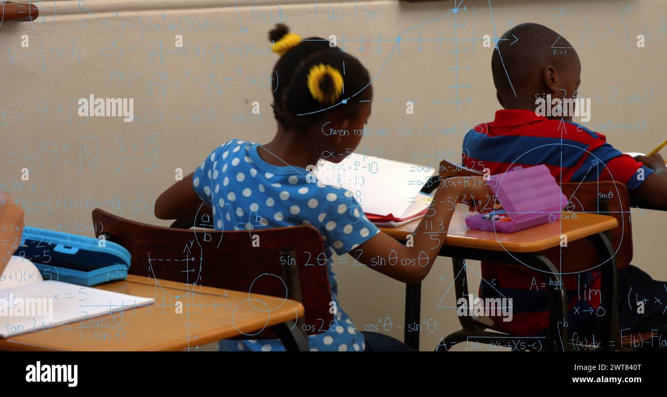 Image of math formulas over african american children learning at ...